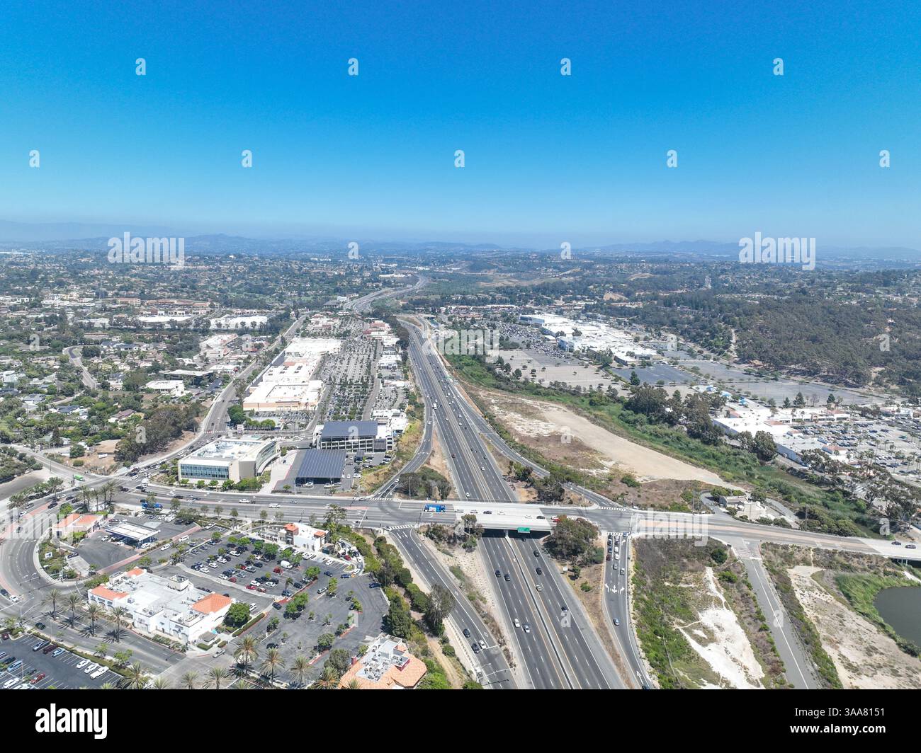 Aerial view of the valley of Oceanside with road and ocean in San Diego ...