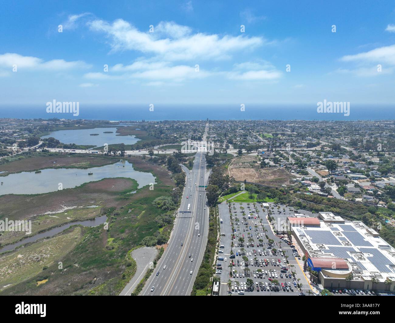 Aerial view of the valley of Oceanside with road and ocean in San Diego ...