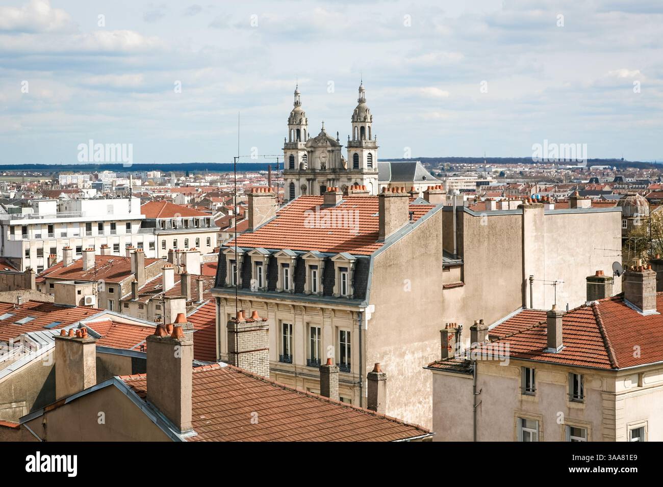 A city Nancy France with many buildings and a large church. The ...