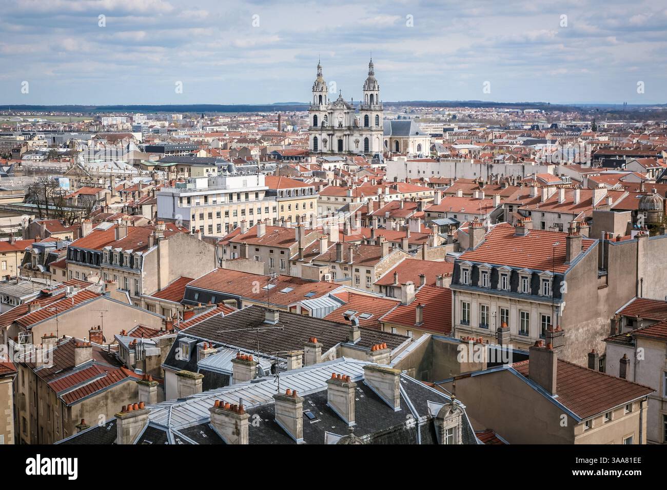 A city Nancy France with many buildings and a large church. The ...