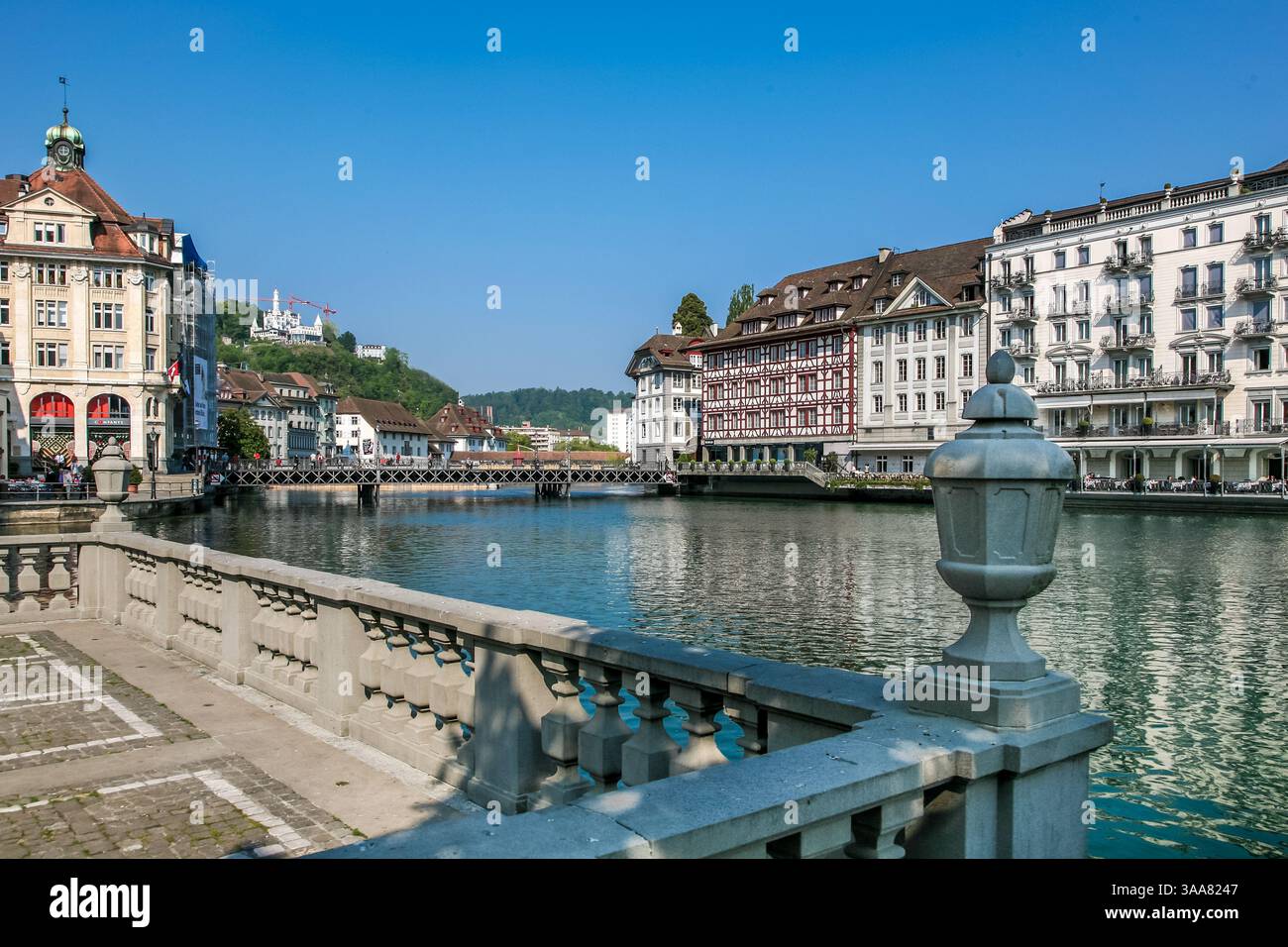 A Luzern city in Switzerland with a river running through it. The river ...