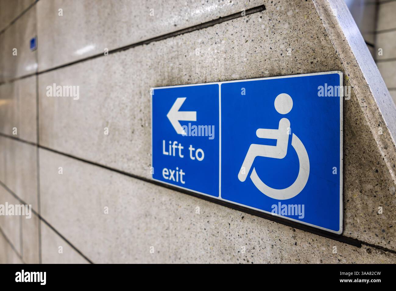 Wheelchair Accessibility Sign with Arrow to Lift in Underground Station ...