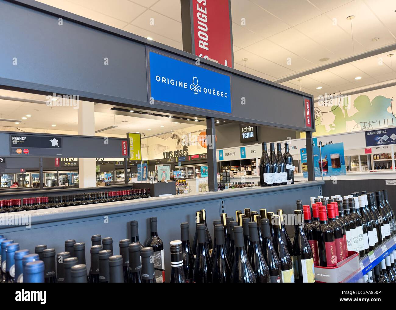 Wine display in a SAQ store featuring bottles from the "Origine Québec ...