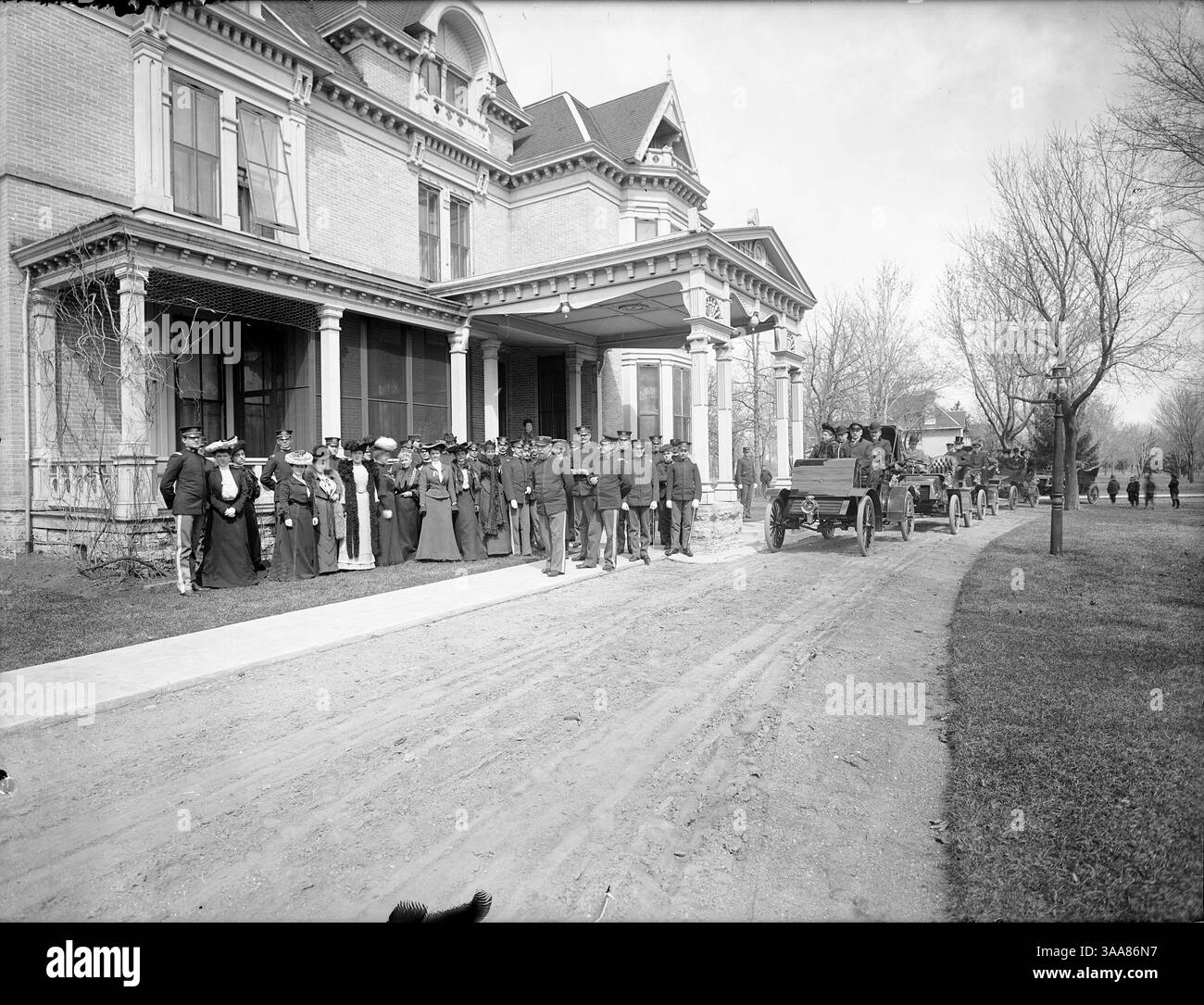 Officers and their wives are pictured at a reception for Admiral ...
