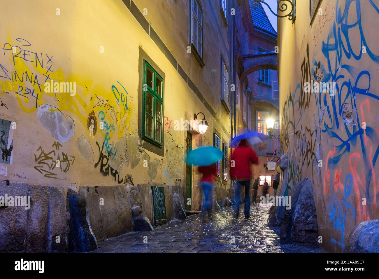 Vienna: alley Griechengasse in Old Town at rainy day, people with ...