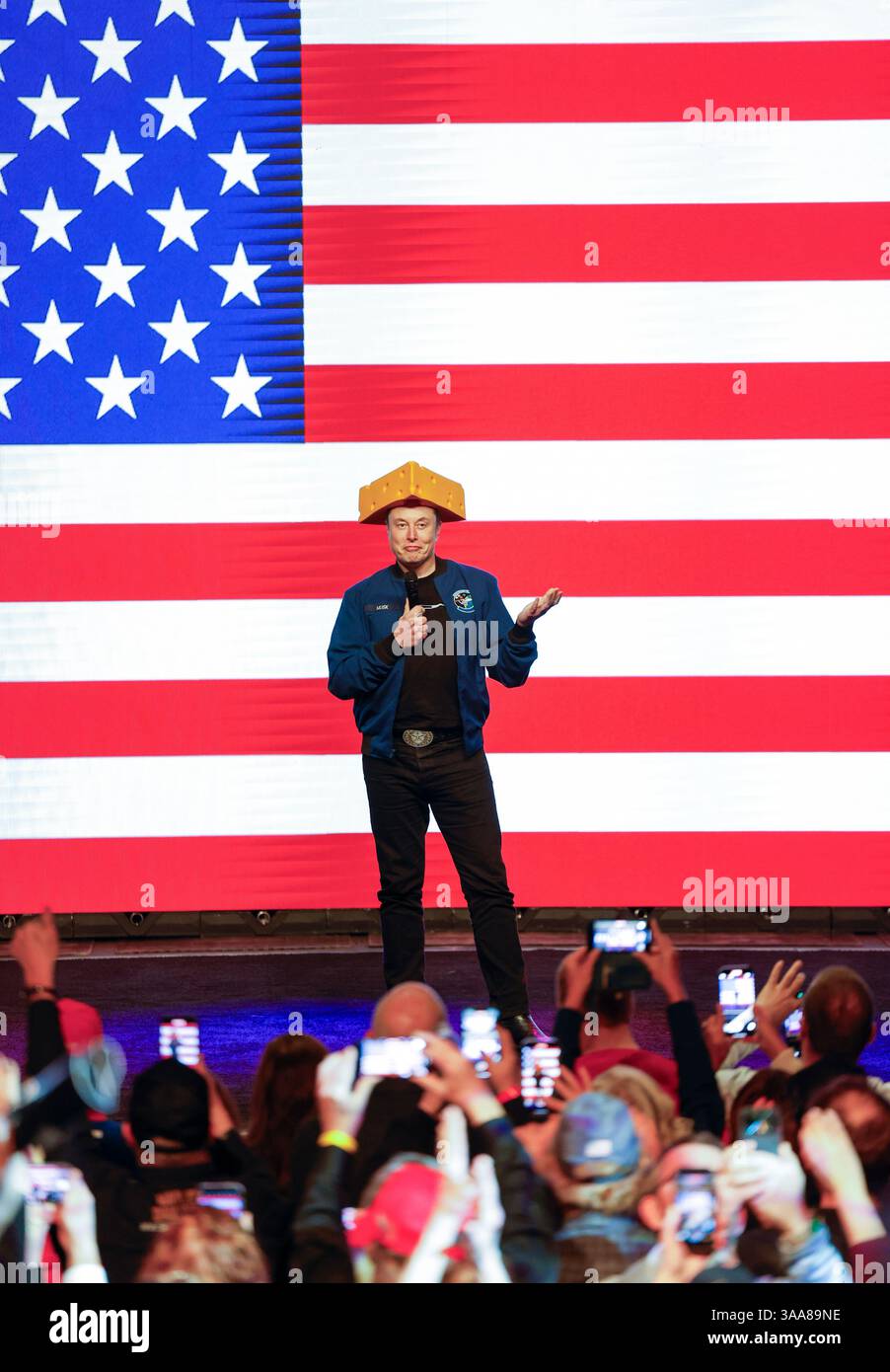 Elon Musk wears a cheesehead during a town hall Sunday, March 30, 2025 ...