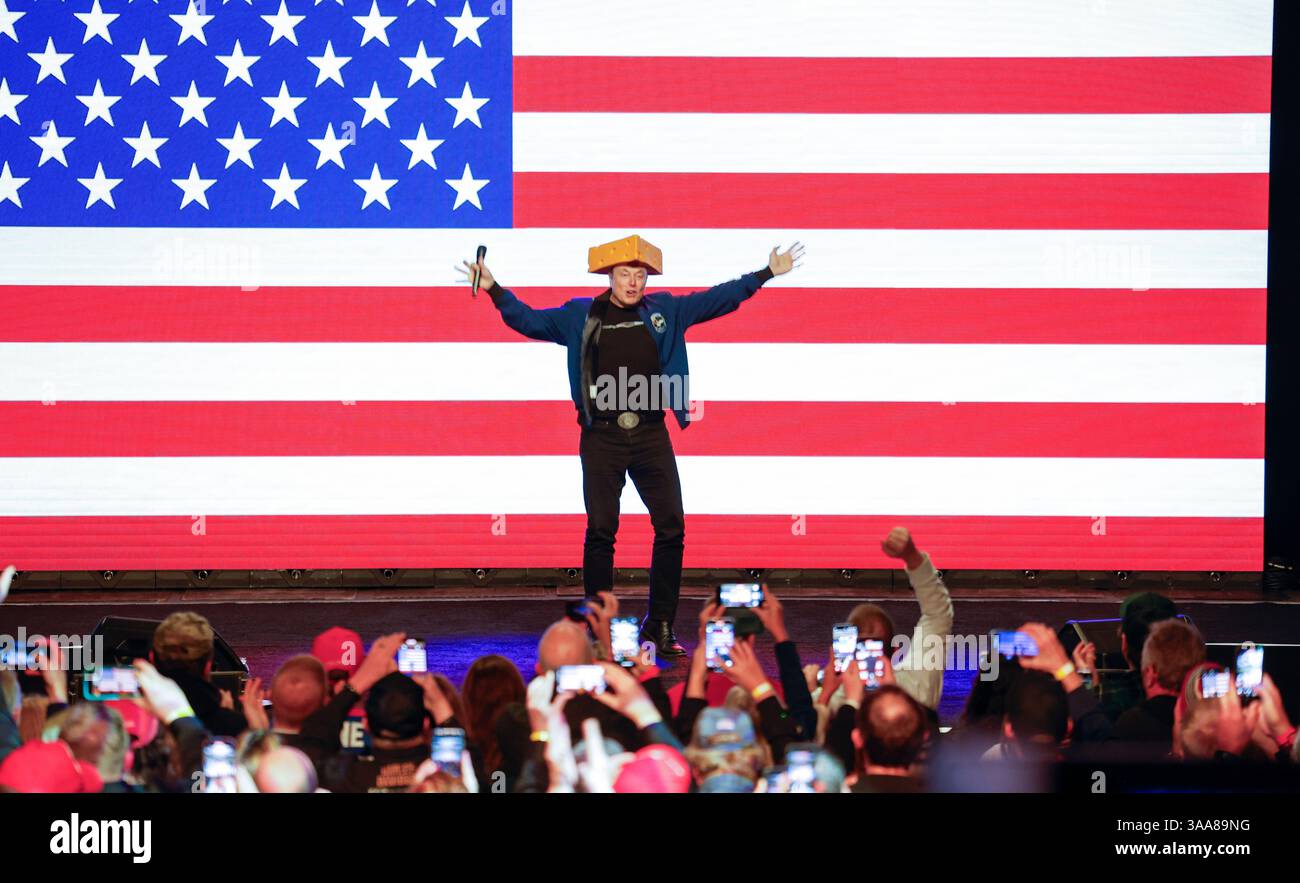 Elon Musk wears a cheesehead during a town hall Sunday, March 30, 2025 ...