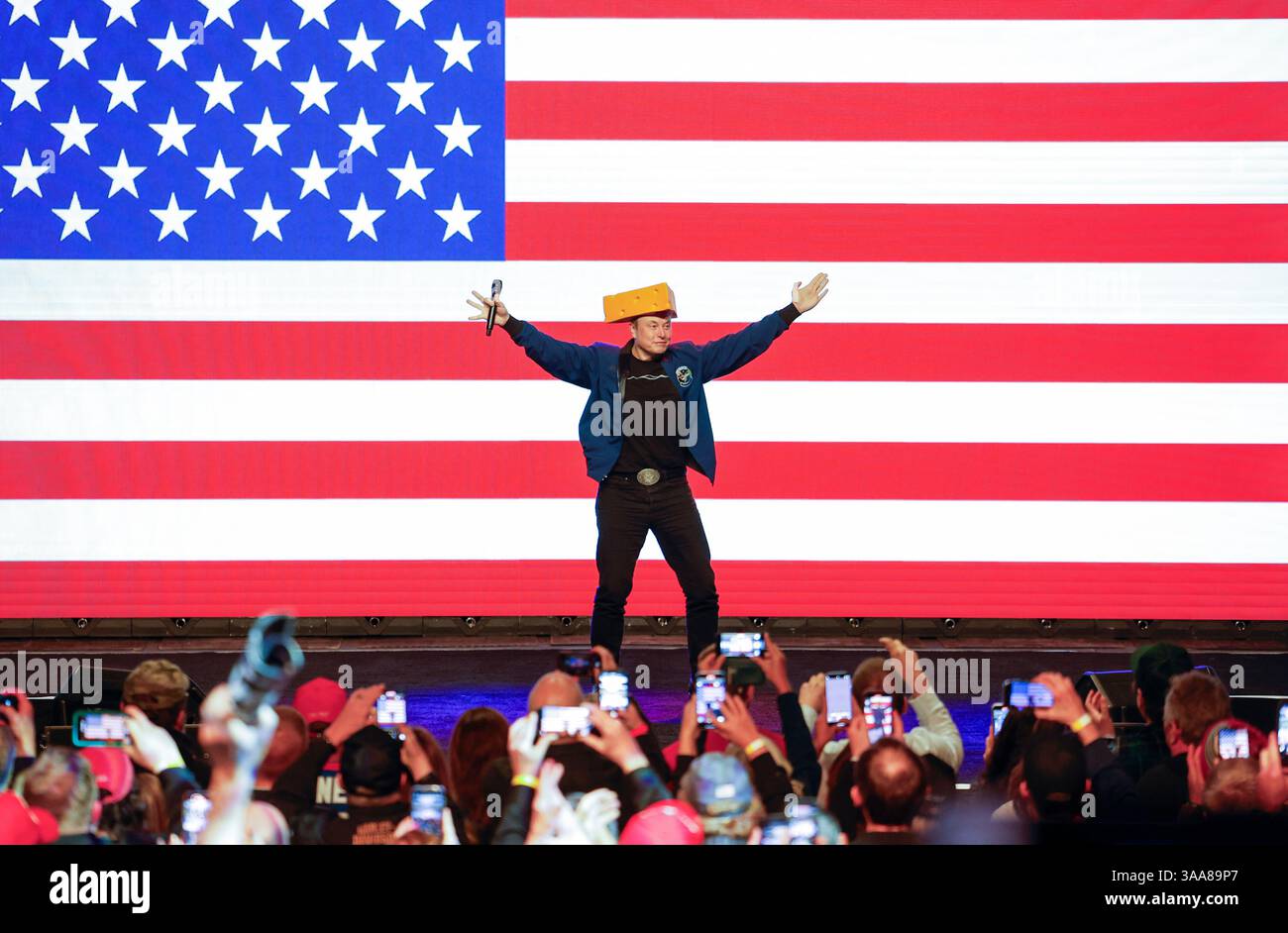 Elon Musk wears a cheesehead during a town hall Sunday, March 30, 2025 ...