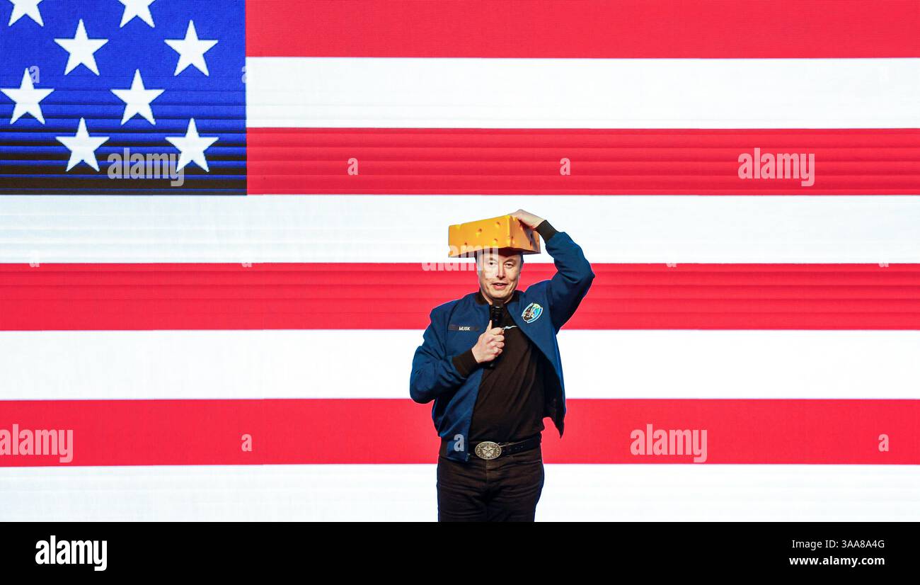 Elon Musk wears a cheesehead during a town hall Sunday, March 30, 2025 ...