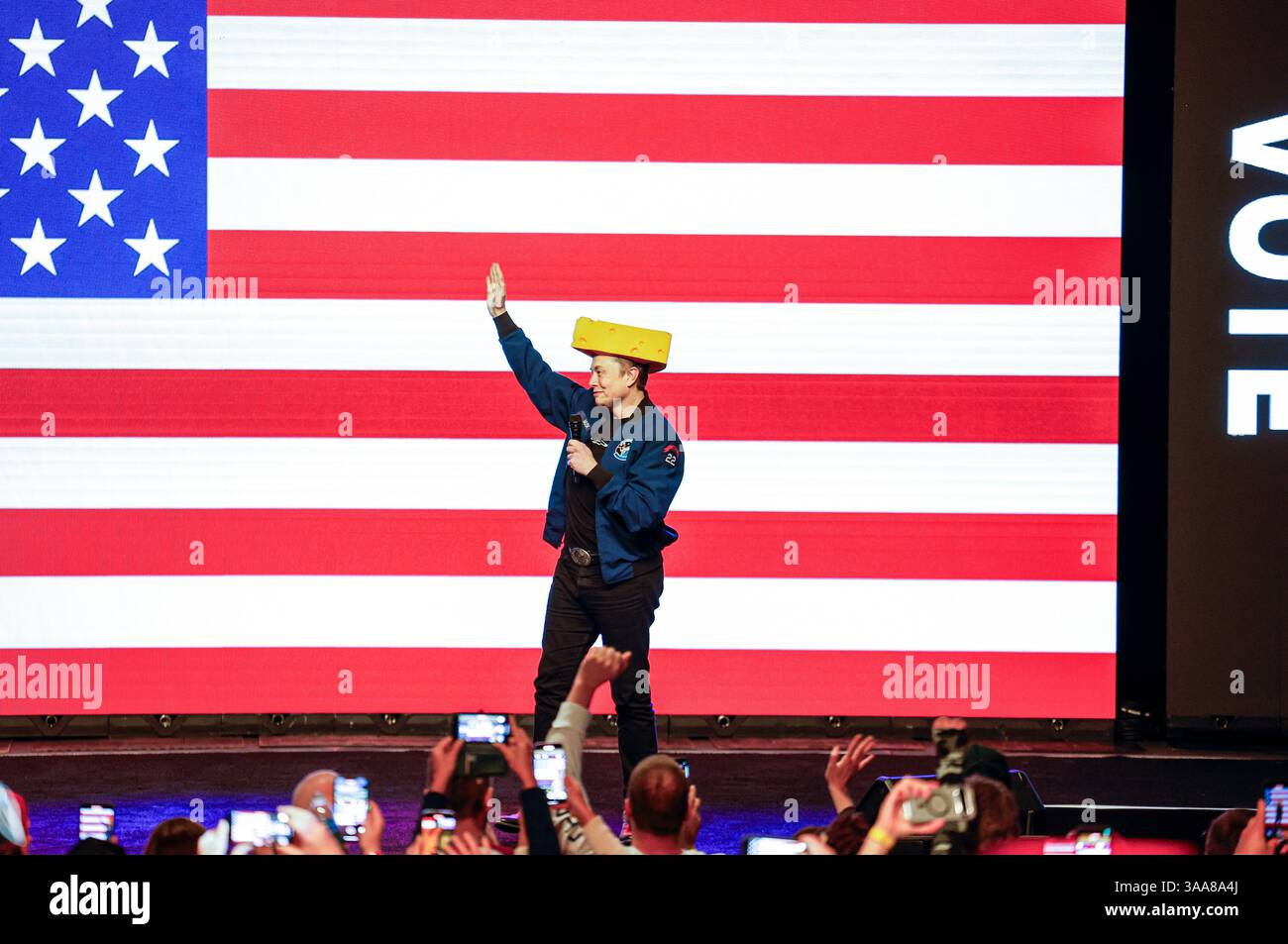 Elon Musk wears a cheesehead during a town hall Sunday, March 30, 2025 ...