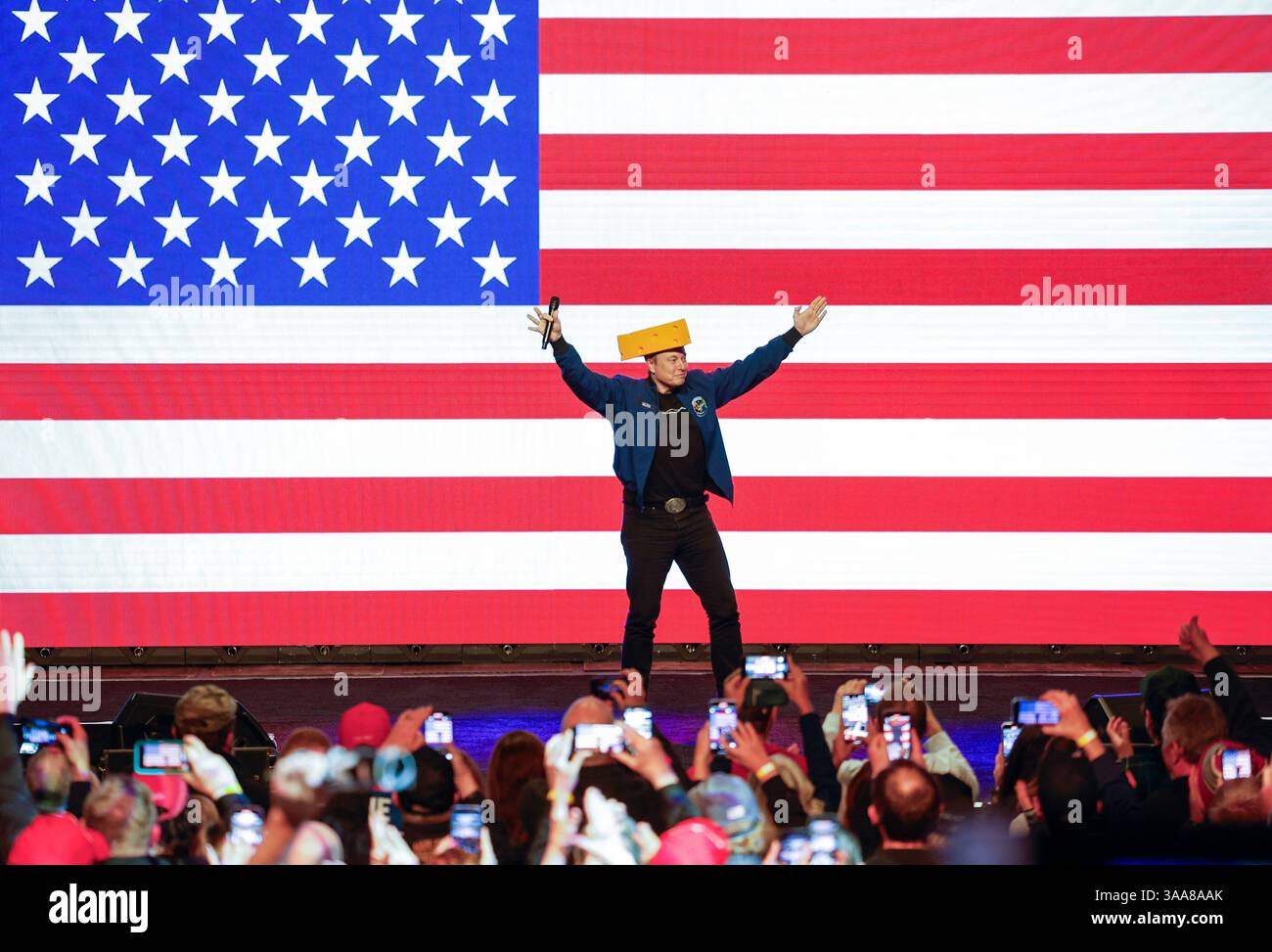 Elon Musk wears a cheesehead during a town hall Sunday, March 30, 2025 ...