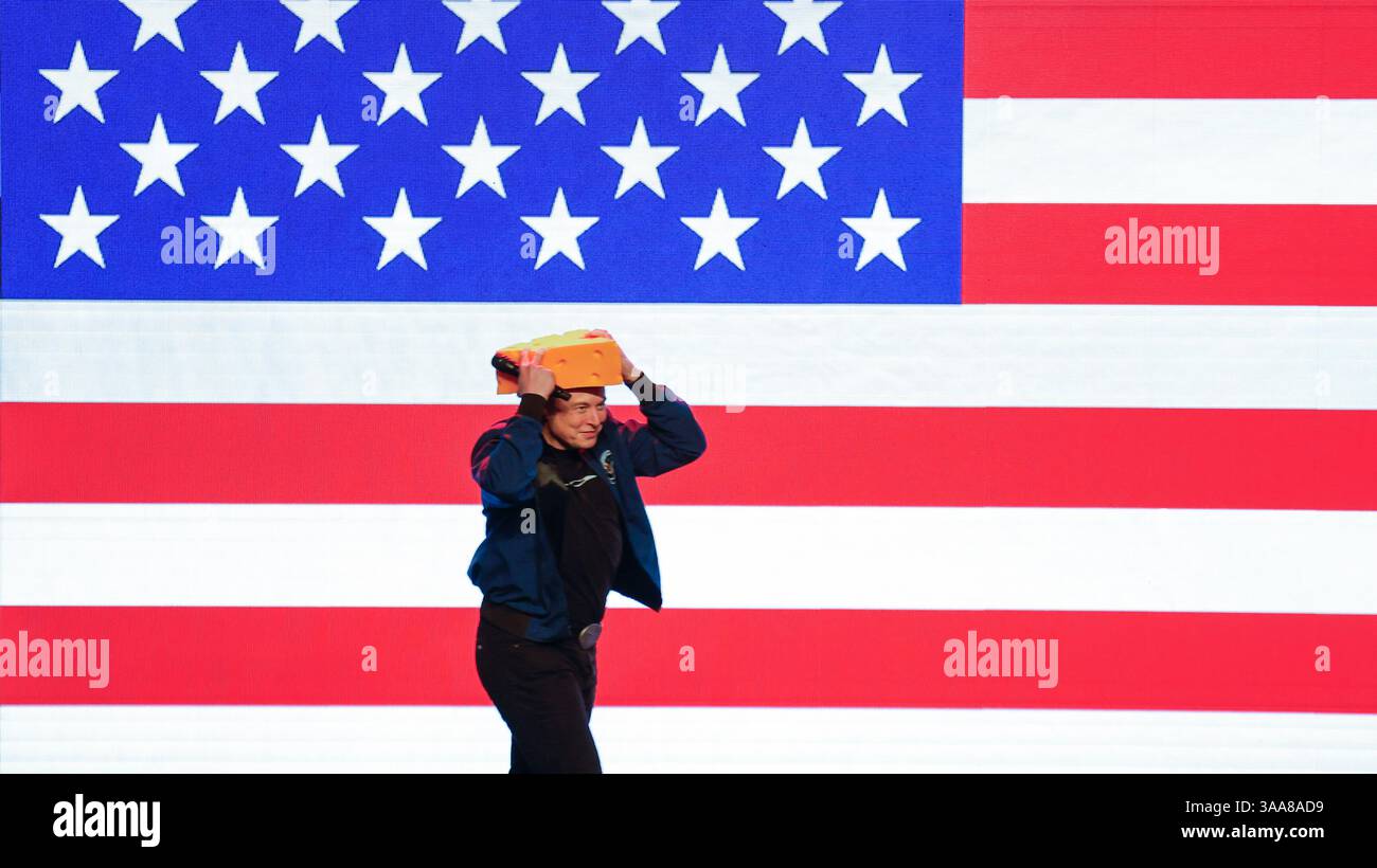 Elon Musk wears a cheesehead during a town hall Sunday, March 30, 2025 ...