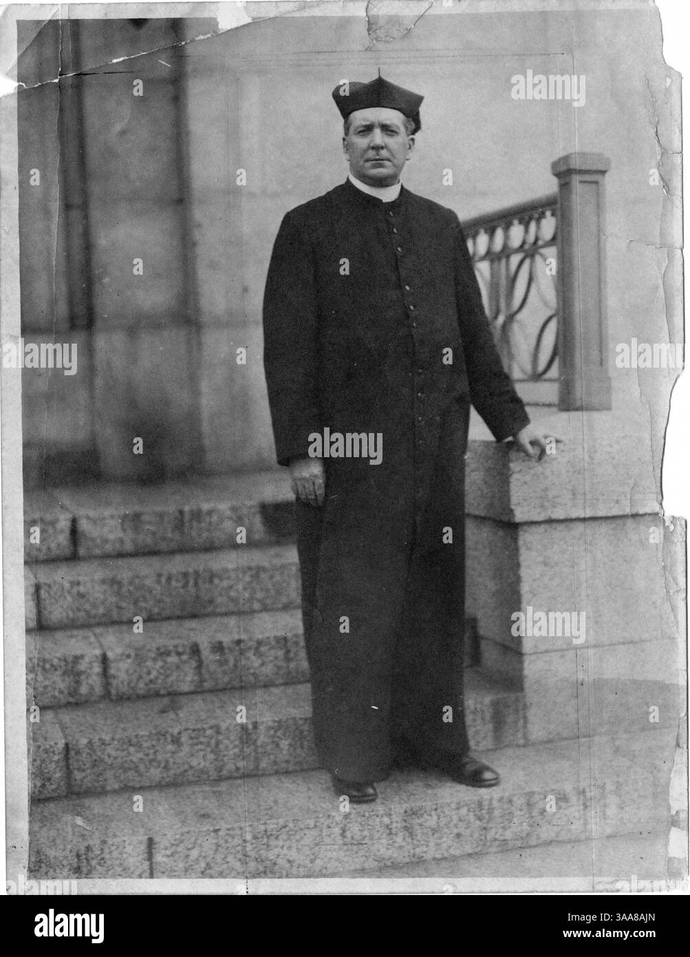 Reverend Thomas E. Cullen is shown standing on the steps of the Pro ...