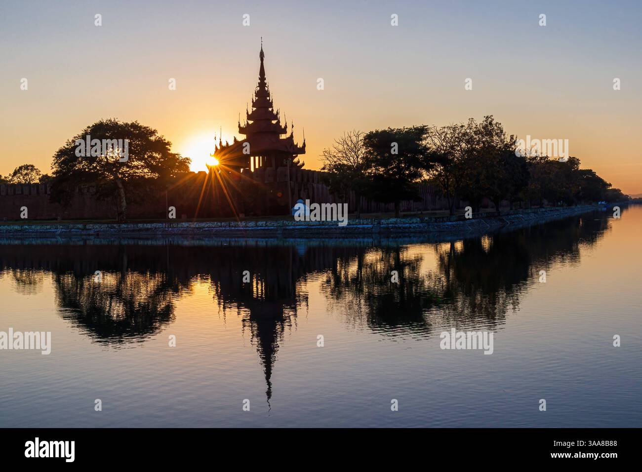 Gorgeous and beautiful sunset by the moat of the Mandalay Palace in ...