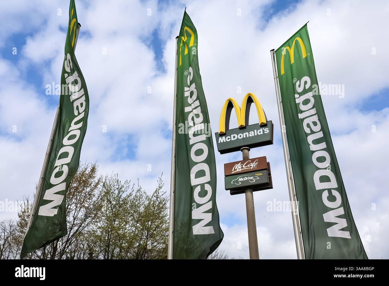 Hamburg, Germany - 28. March 2024: Green McDonald's flags waving in the ...
