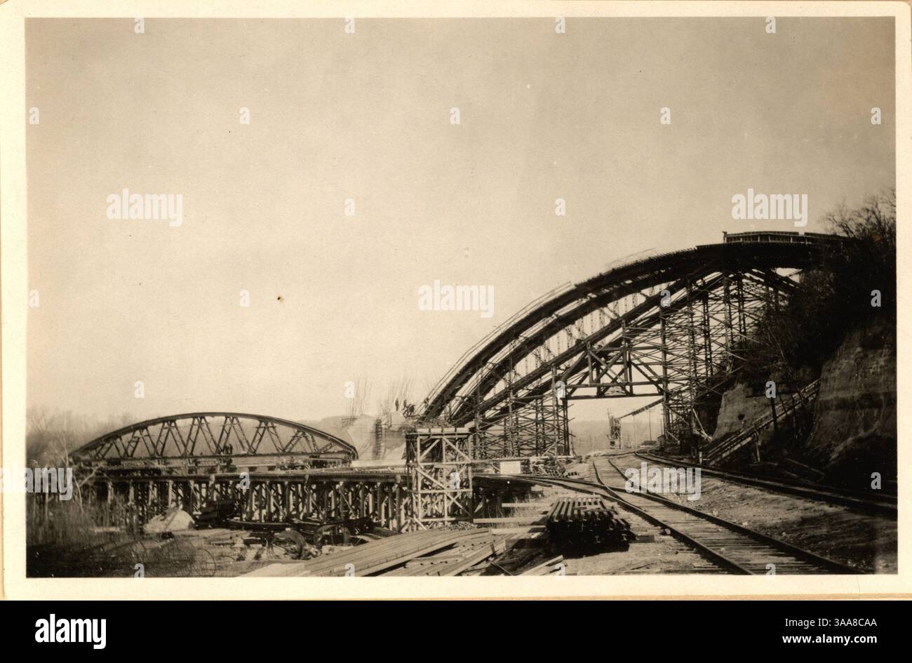 The Mendota Bridge under construction shows the metal and wooden ...