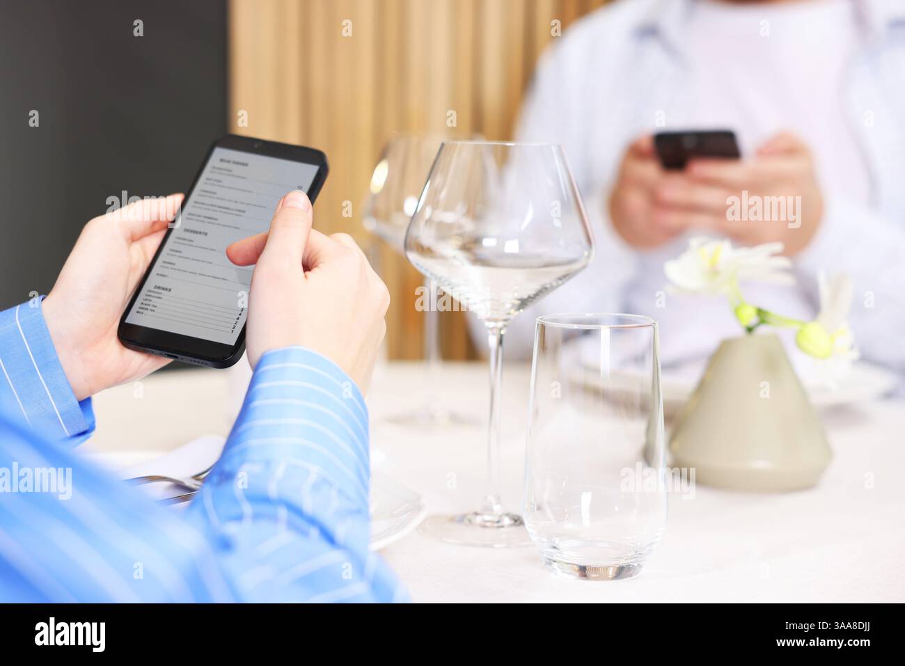 Couple choosing dishes from digital menu at restaurant, closeup Stock ...