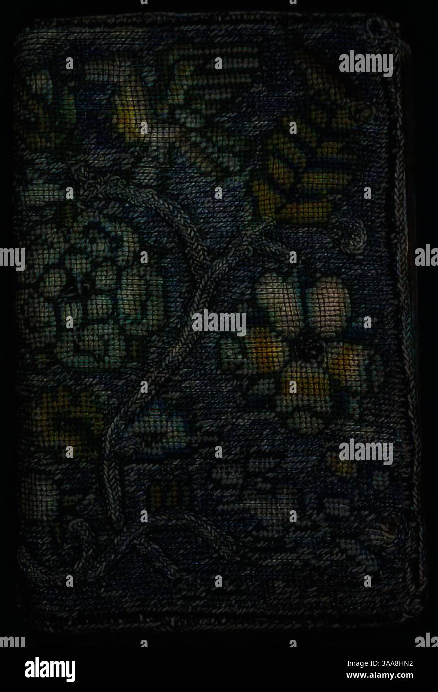 A textured surface features intricate floral patterns, with hints of ...