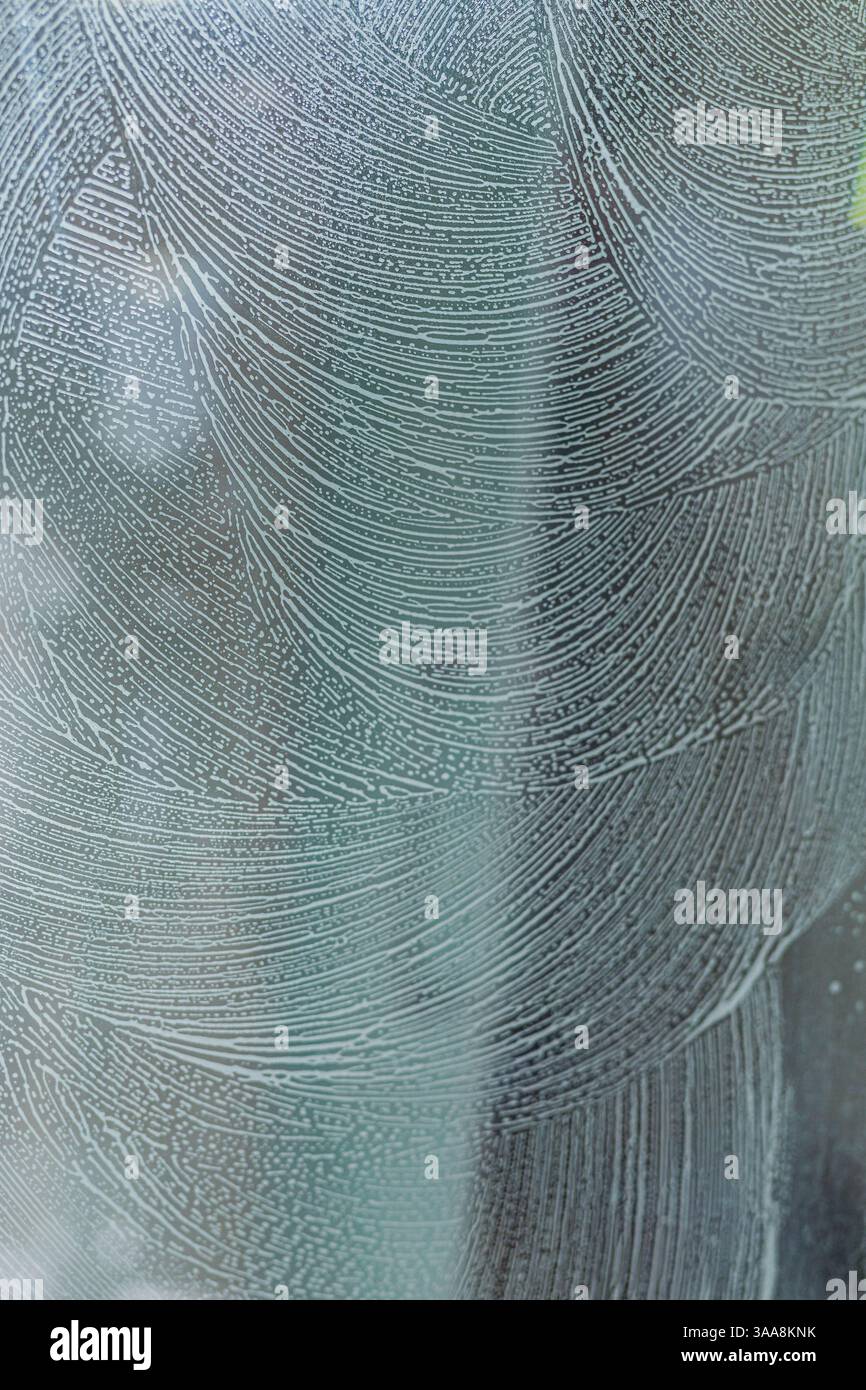 soap foam pattern wipe marks on window glass, window cleaning , blue ...