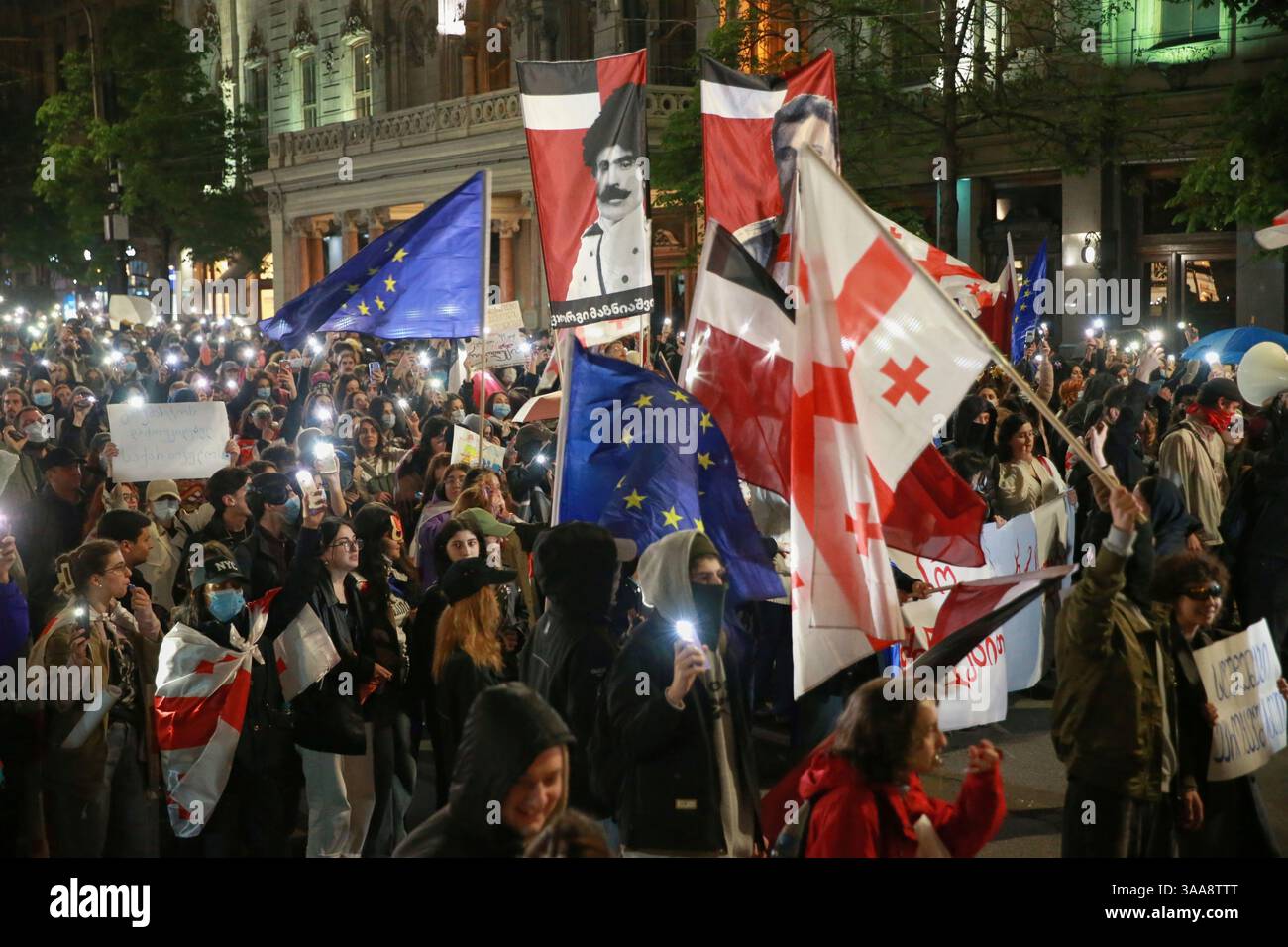 Demonstrators with EU and Georgian national flags rally to call for the ...