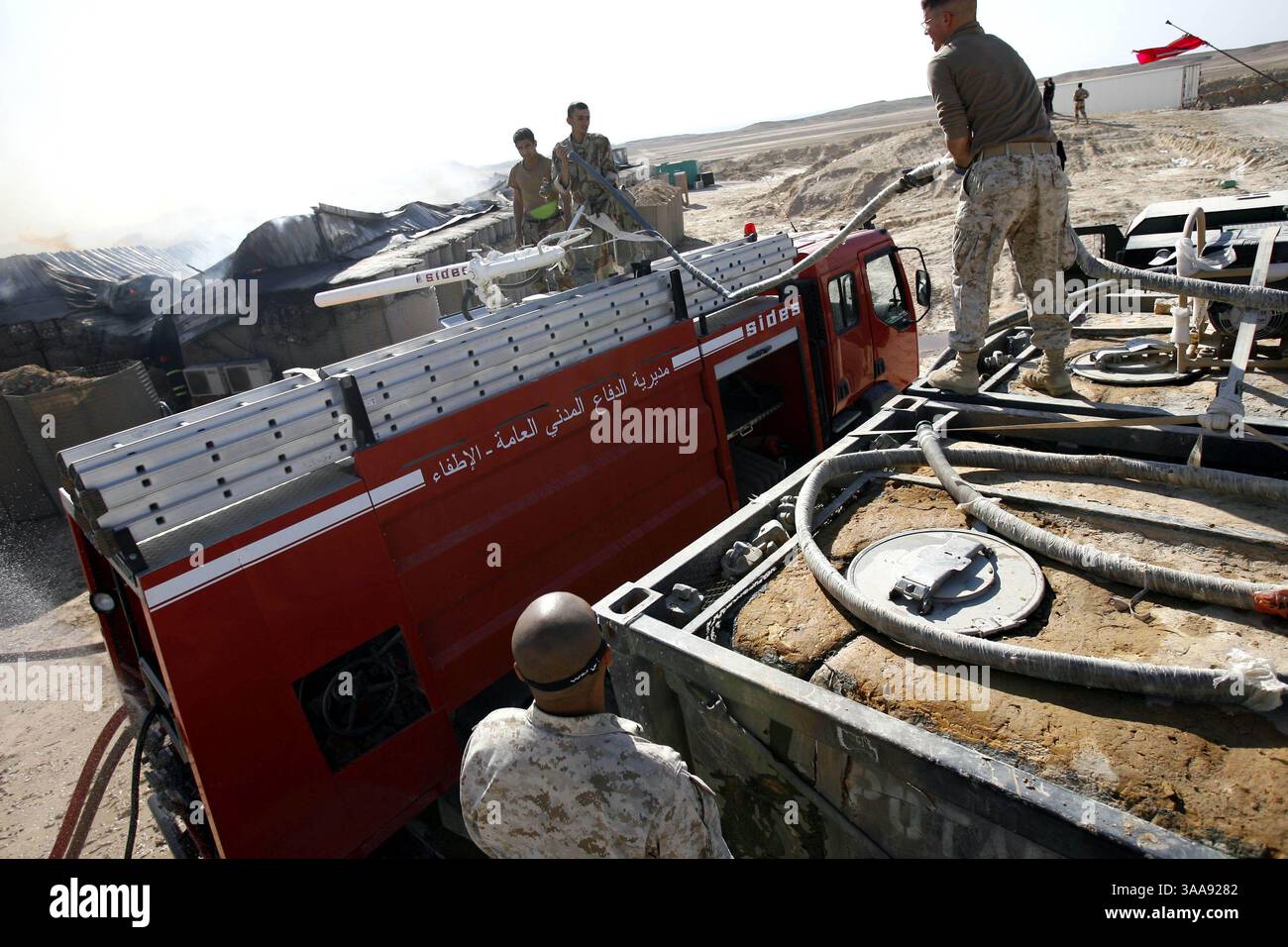 Nov 24, 2006; Rawah, IRAQ; Lance Cpl. Kreg Pringle (right), a 21-year ...