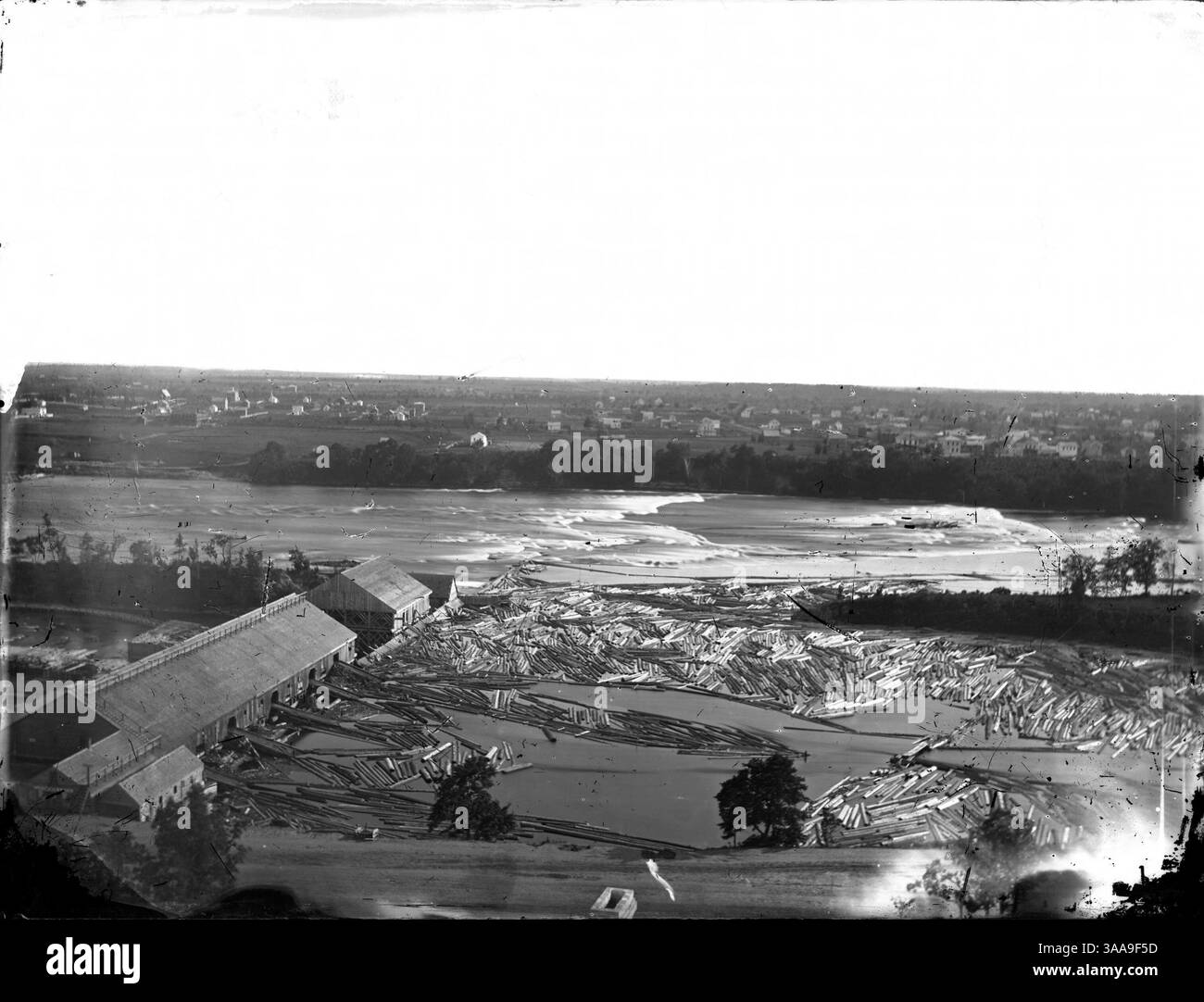 A historic view of the East Side Sawmills and St. Anthony Falls in ...