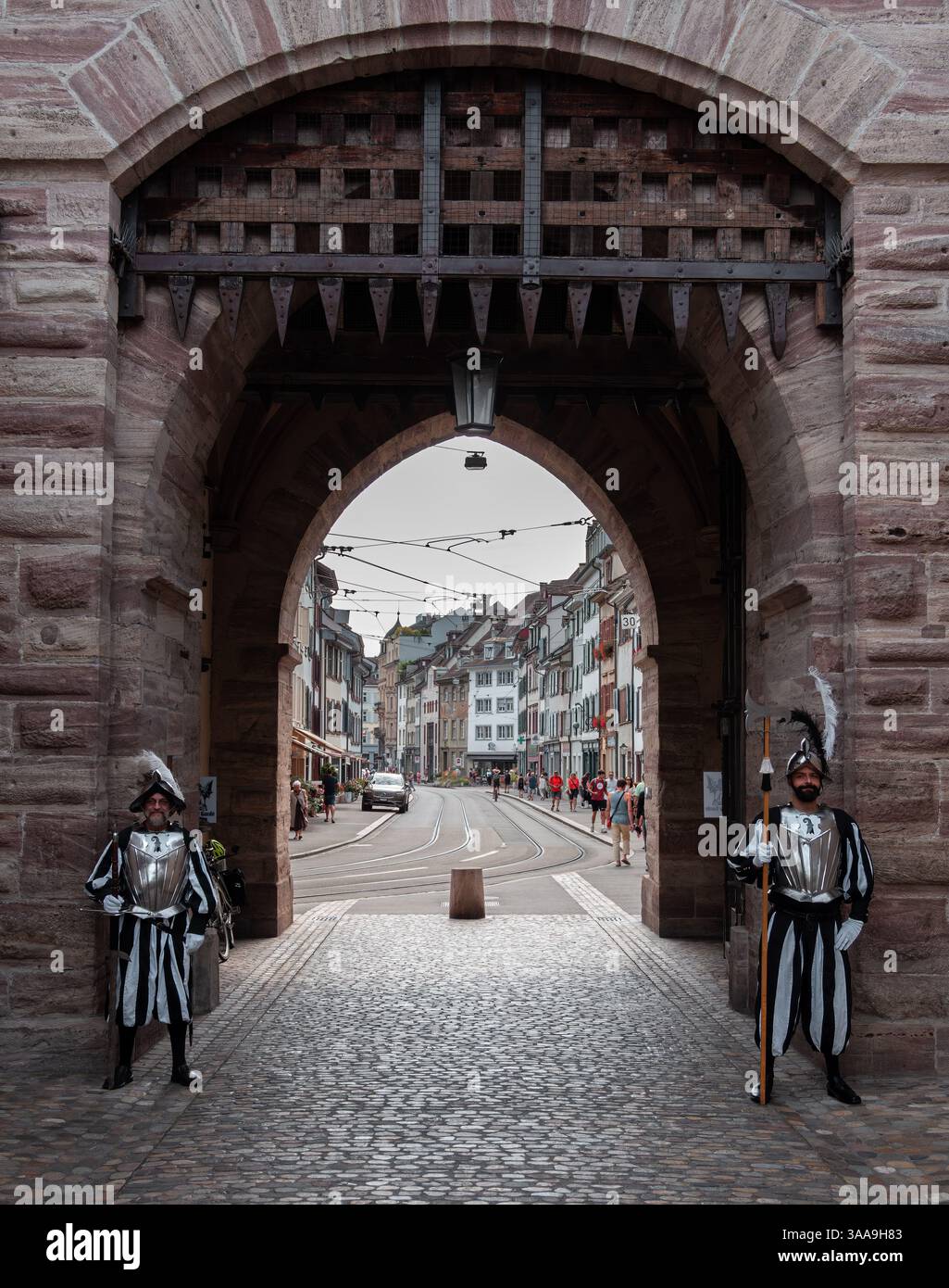 Basel, Switzerland - August 17, 2024: Medieval gate with two guards in ...