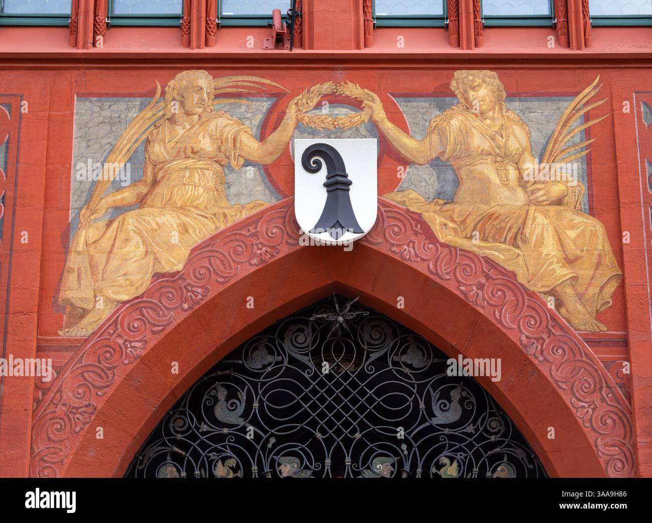 Basel, Switzerland - August 17, 2024: A detailed mural above an arched ...