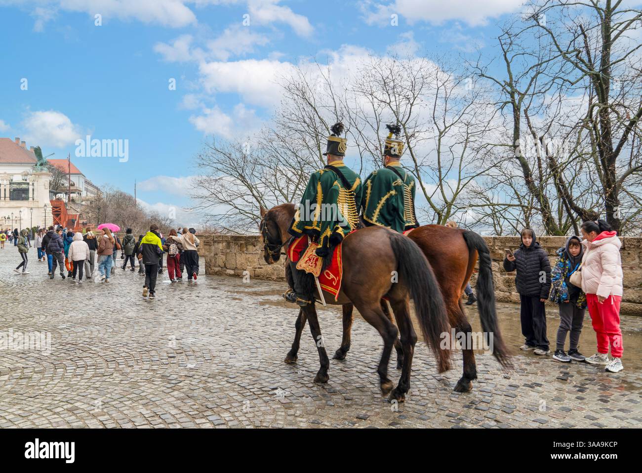 Budapest, Hungary - March 15, 2025: Back view of two Hungarian soldiers in historical costume on ...
