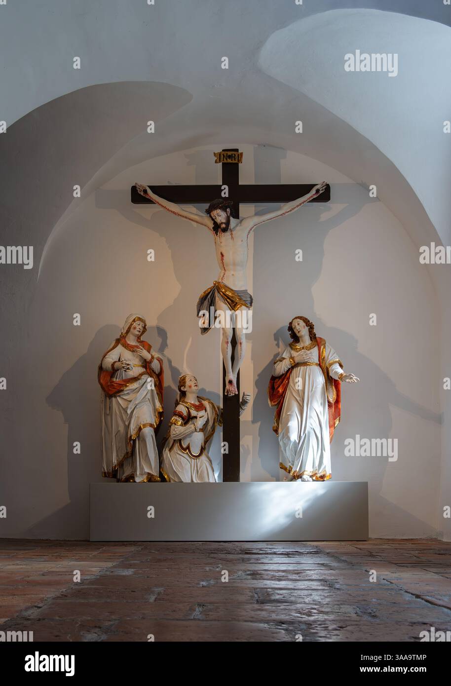 Michaelbeuern, Austria - October 22, 2024: A religious sculpture depicting the crucifixion of ...