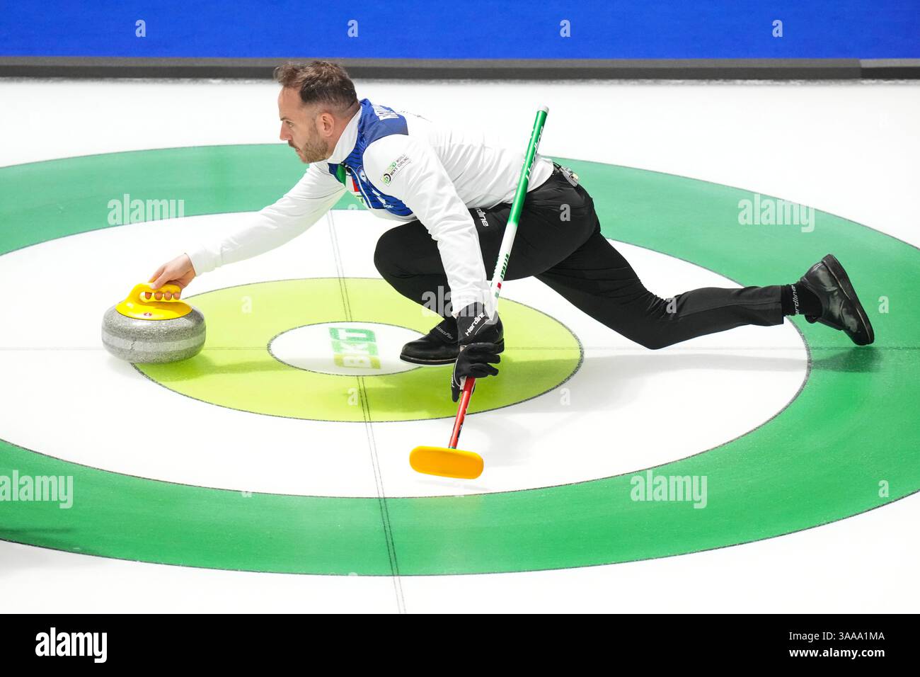 Moose Jaw, Can. 31st Mar, 2025. Italy's skip Joel Retornaz throws a ...