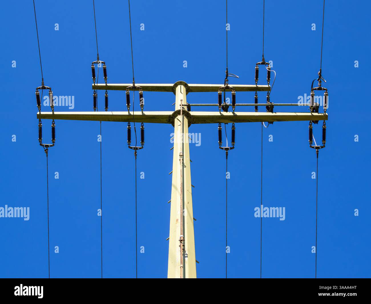 Power line utility pole with high-voltage transmission lines against ...