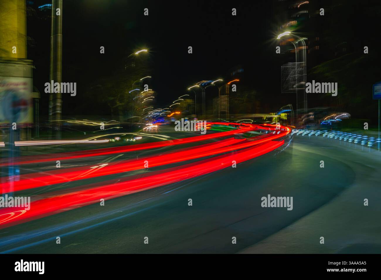 Red neon trails in night on city road long exposure. Multiple red light ...