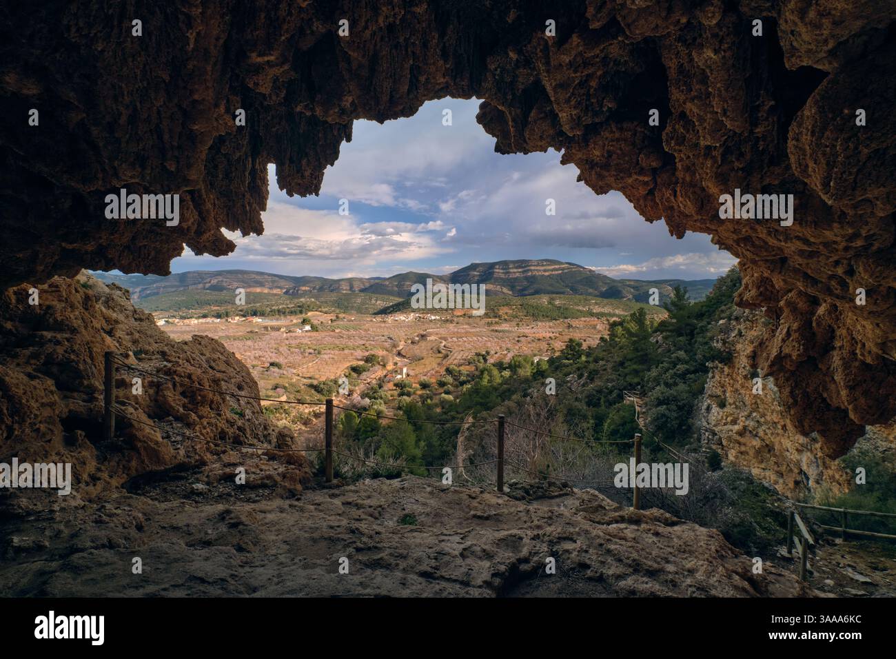View of the exit from the cave in the mountains Stock Photo - Alamy