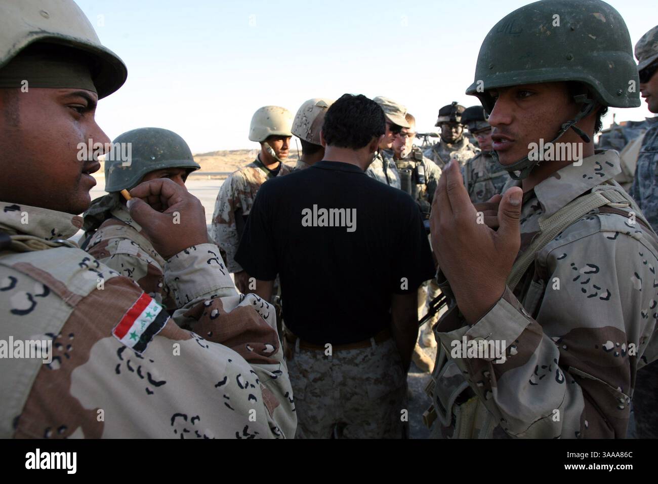 Jun 20, 2006; Hit, Al Anbar, IRAQ; Iraqi soldiers converse minutes ...