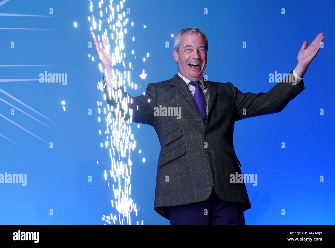 Reform UK leader Nigel Farage arrives on stage to speak during Reform ...