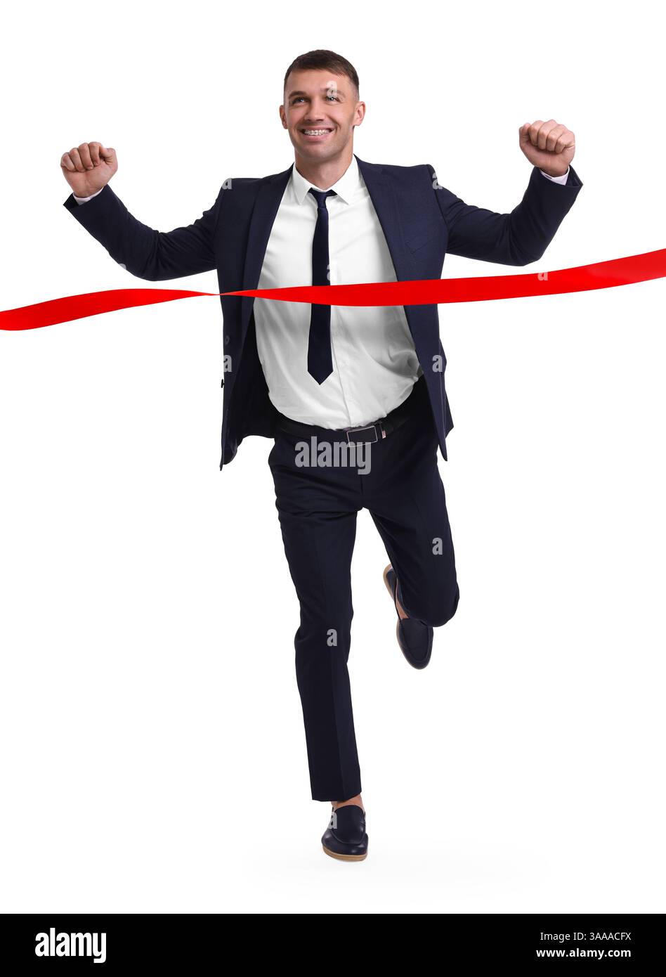 Happy businessman crossing red finish line ribbon on white background ...