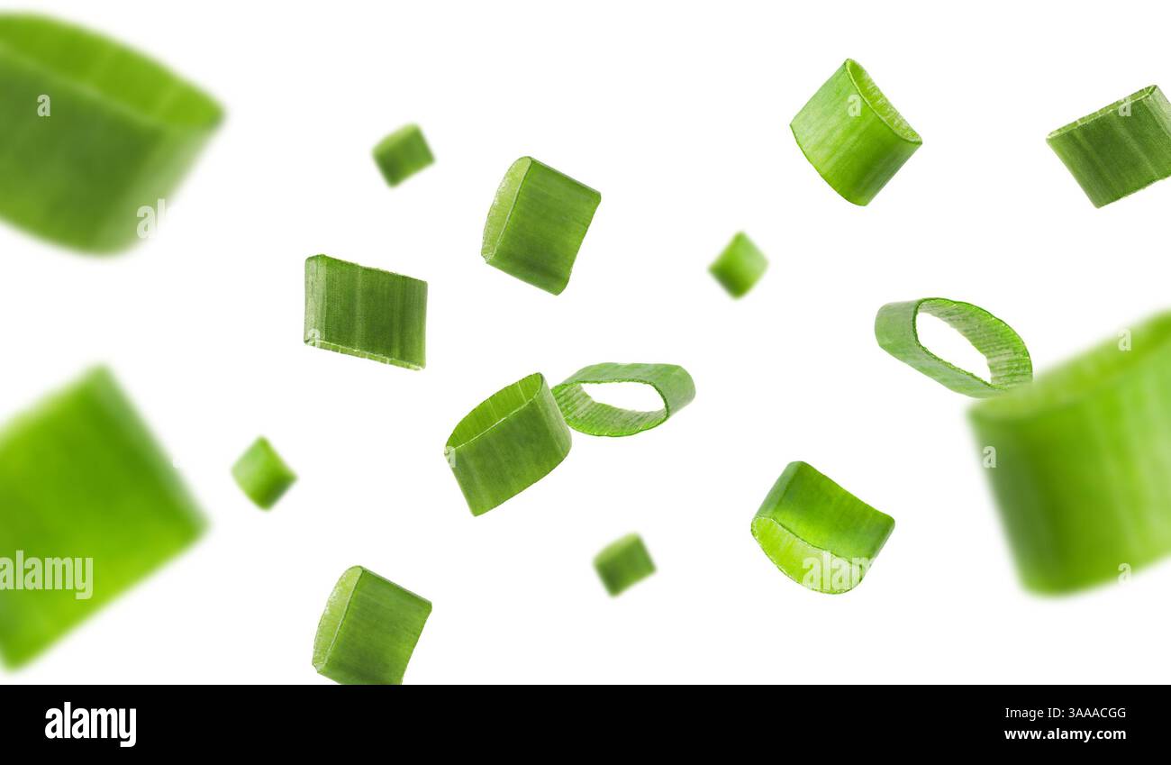 Chopped green onion. Fresh slices flying on white background Stock ...