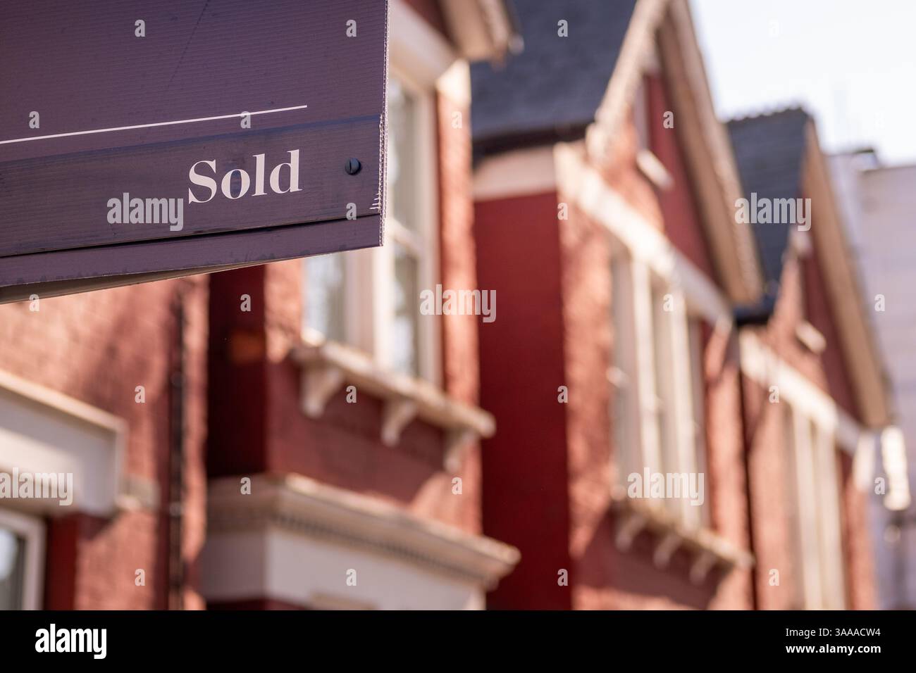UK- London houses SOLD advertised by estate agent sign Stock Photo - Alamy