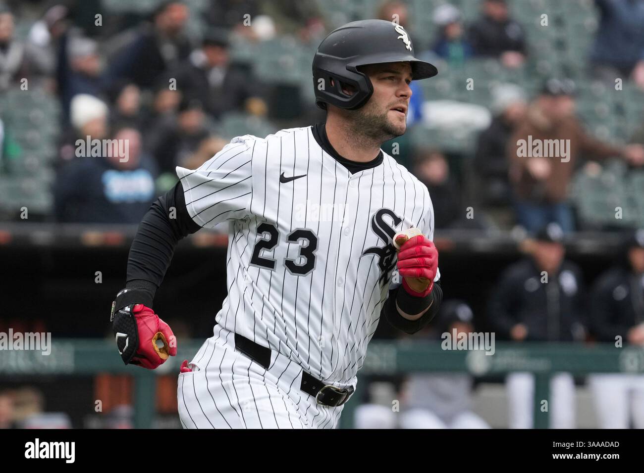 Chicago White Sox's Andrew Benintendi rounds the bases after hitting a ...
