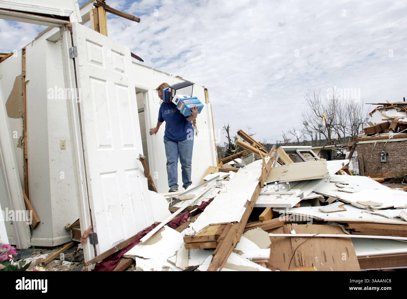 Mar 02, 2007 - Enterprise, AL, USA - Cheryl Sutherland removes shoes ...