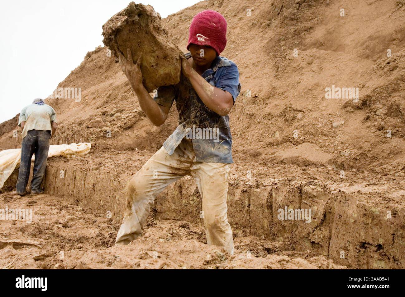 Jun 30, 2006; Phnom Penh, CAMBODIA; Brick factory workers stack mud ...