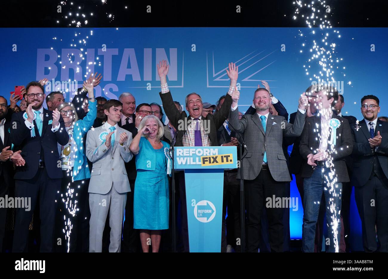 Reform UK leader Nigel Farage is joined on stage by prospective ...