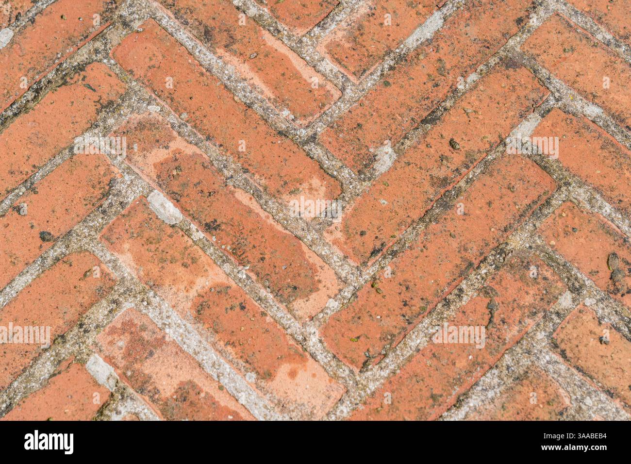 A brick floor with a diamond pattern in Gubbio, Umbria Italy. The ...