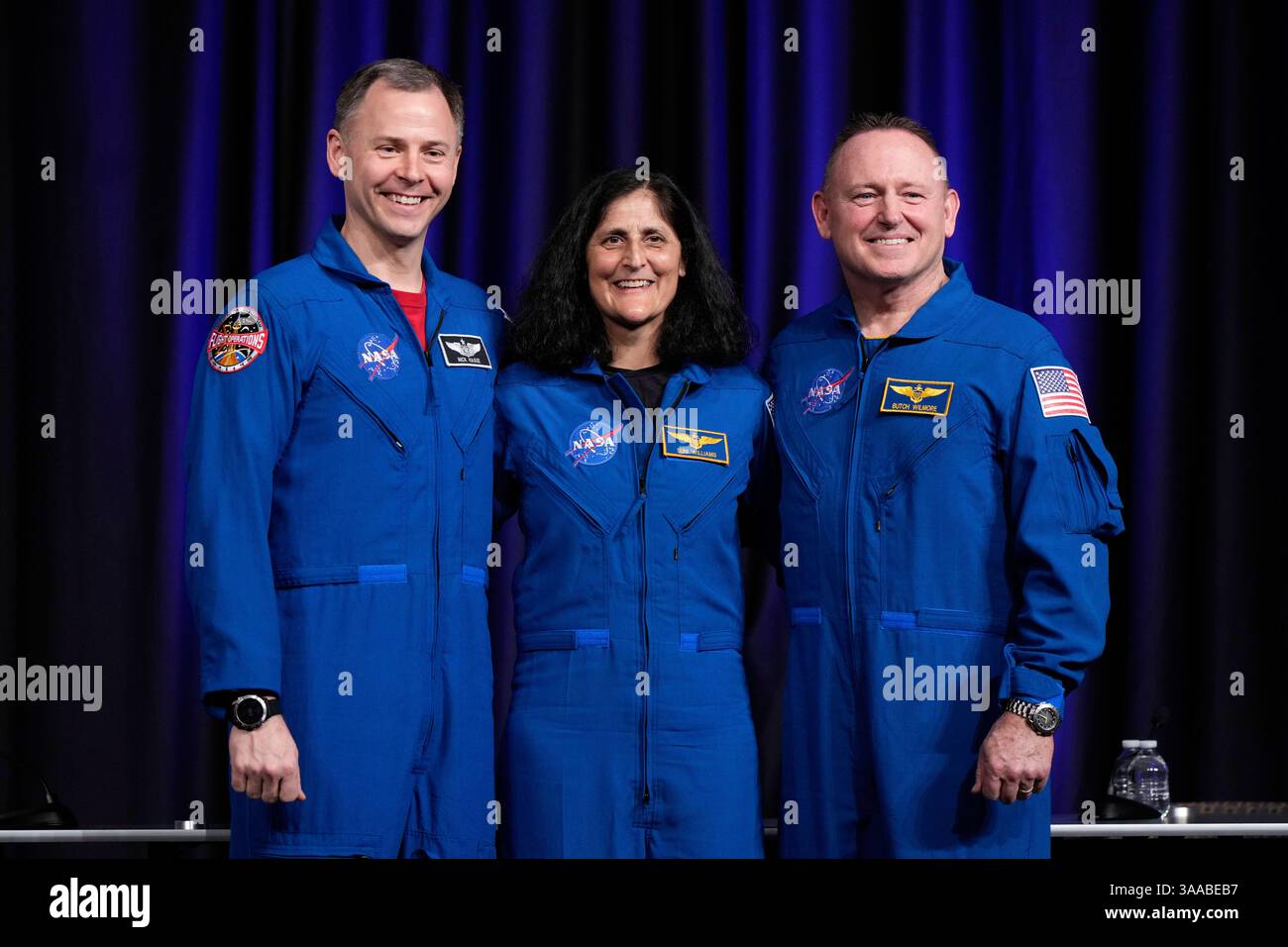 Astronauts Nick Hague, Suni Williams, and Butch Wilmore pose for a ...