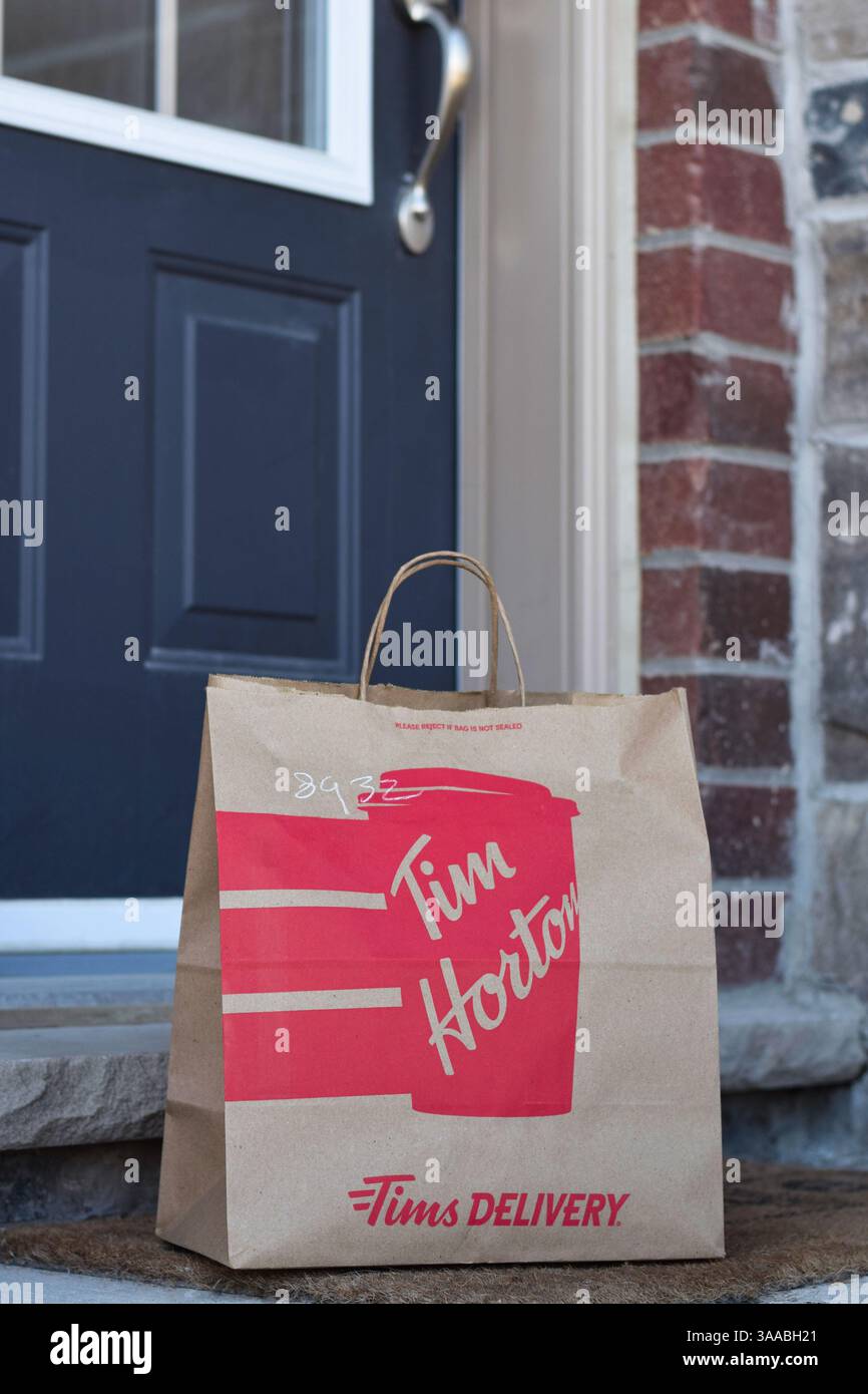 Tim Hortons food delivery order bag on a front porch of a house Stock ...