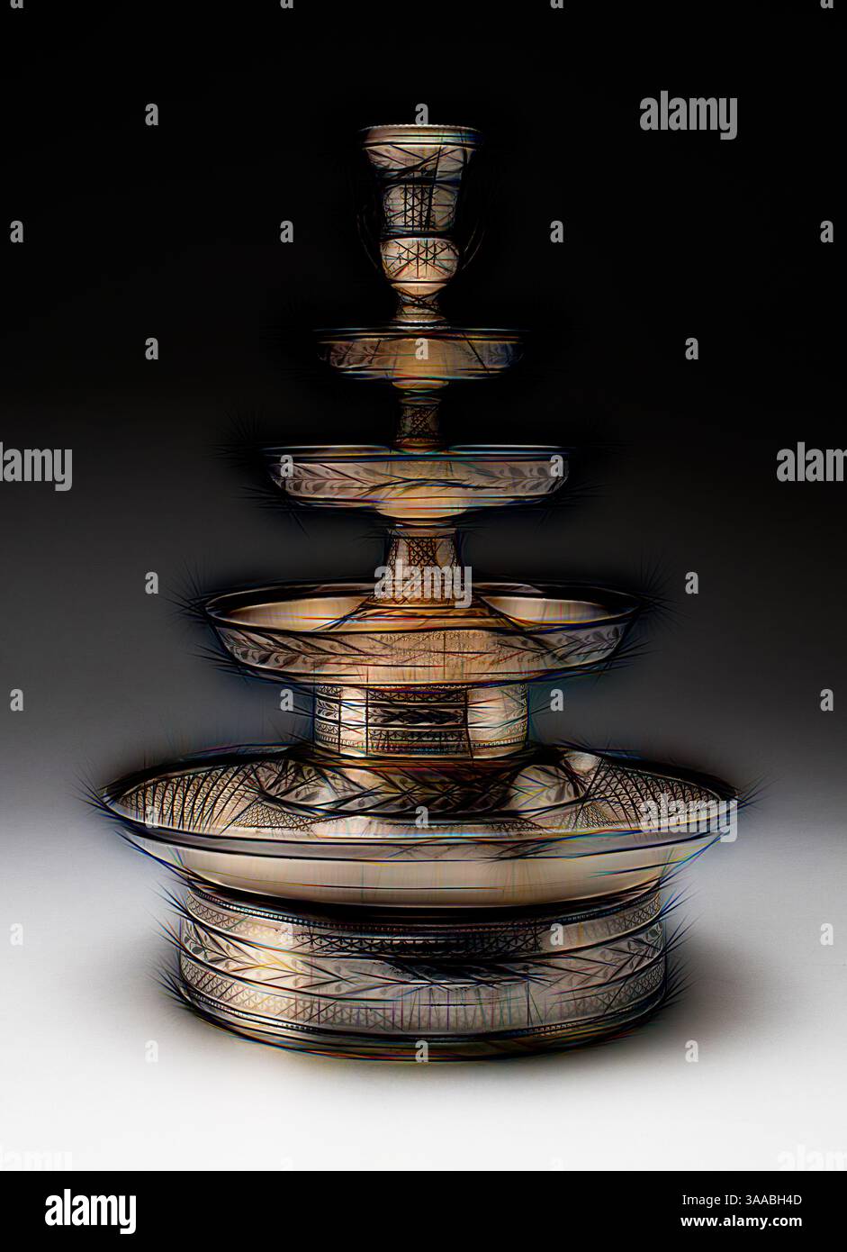 A beautifully designed multi-tiered fountain features intricate ...