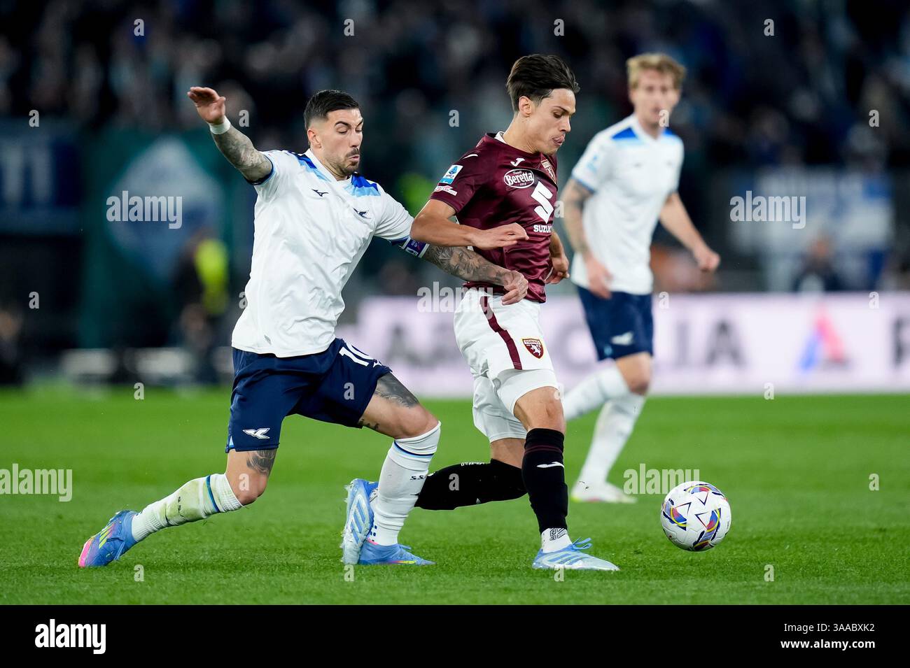 Mattia Zaccagni of SS Lazio and Samuele Ricci of Torino FC compete for ...