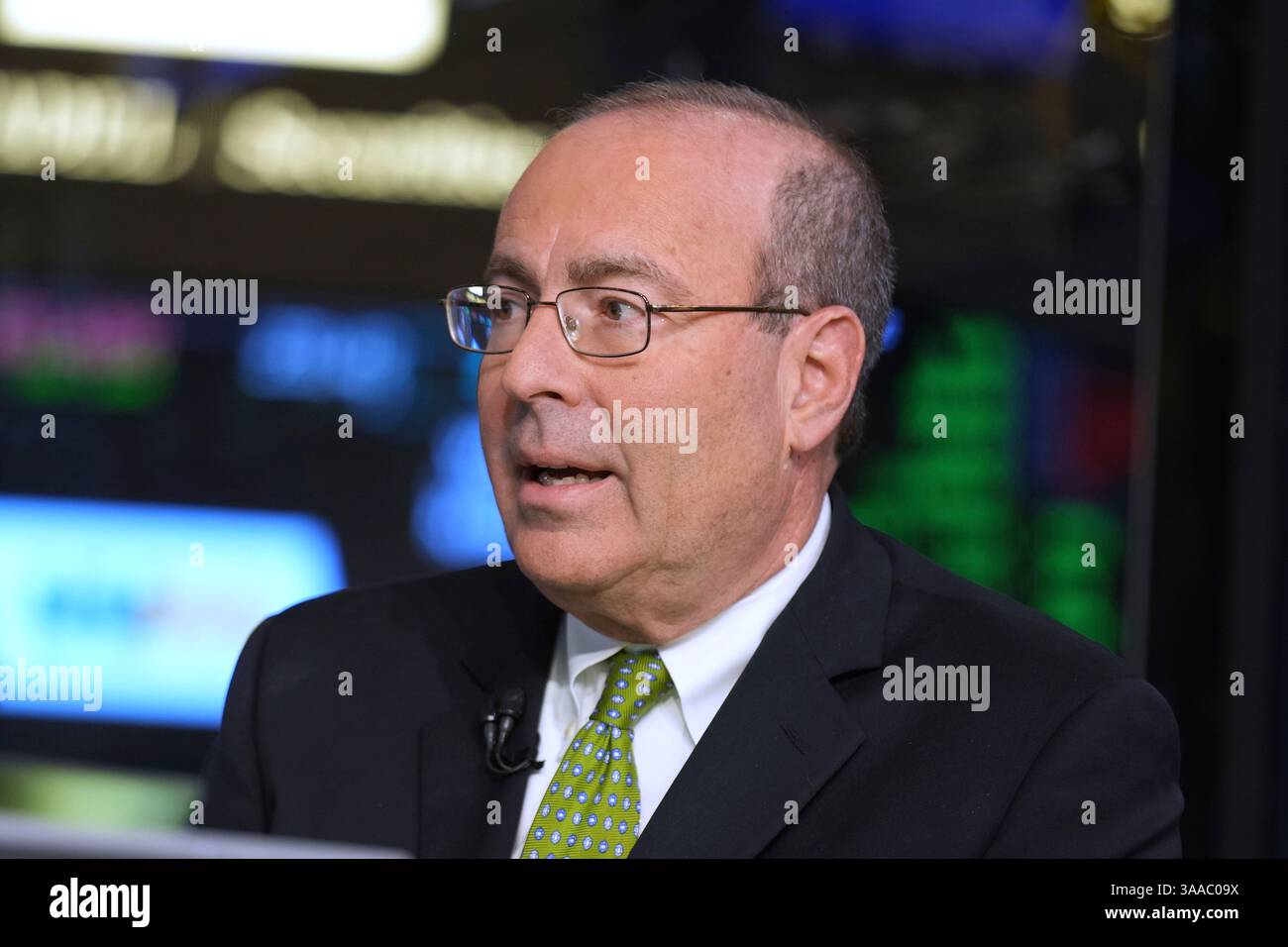 Richmond Fed president Tom Barkin talks to reporters on the floor at ...