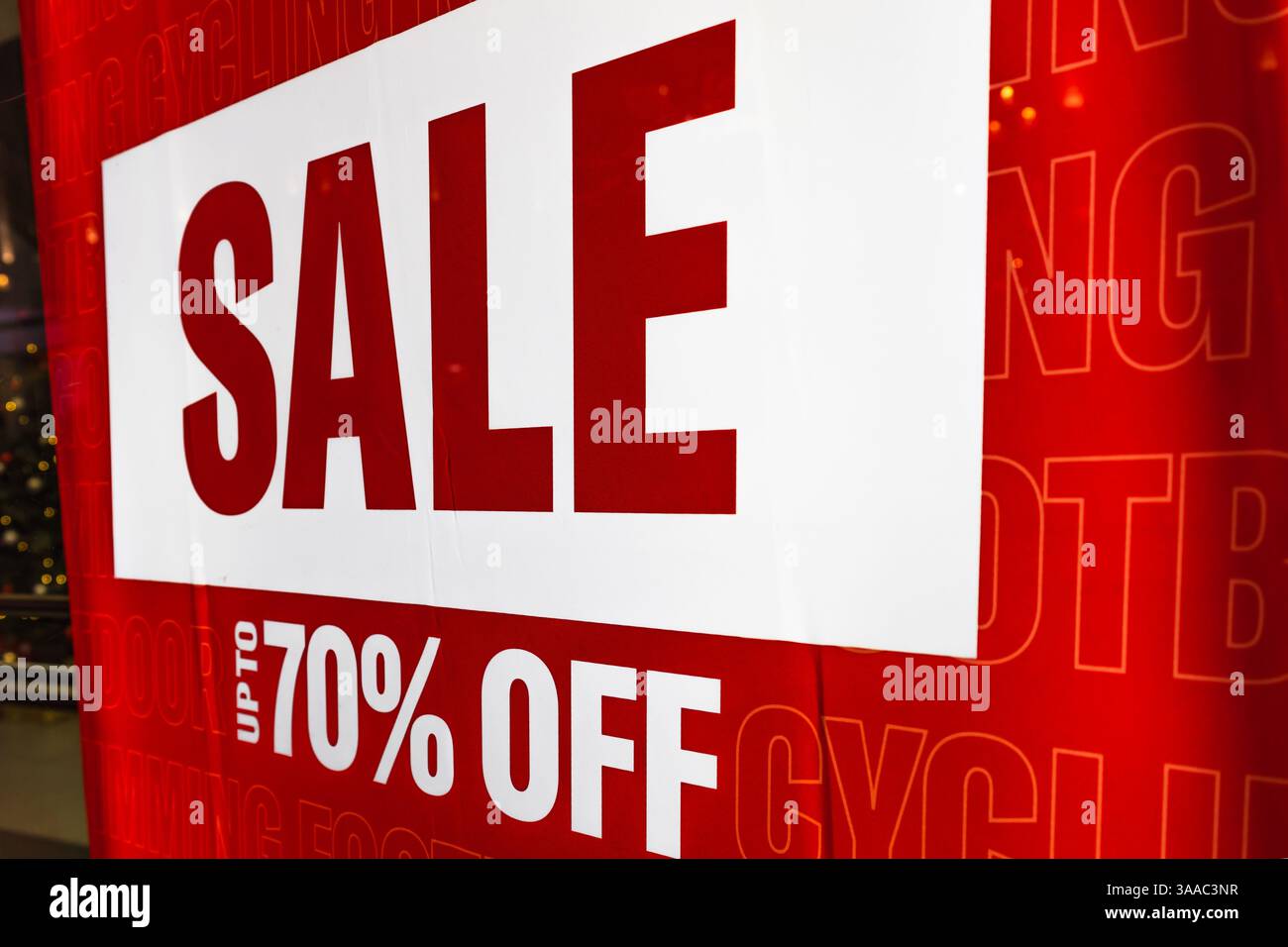 Bold Red Sale Sign with Up to 70 Percent Off Displayed in Store Window ...